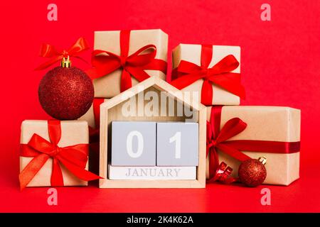 1 january. Christmas composition on colored background with a wooden ...