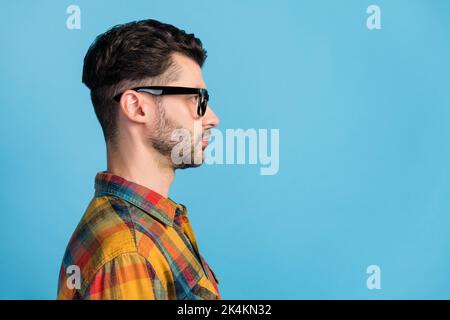 Photo of intelligent serious guy dressed eyewear typing code modern ...