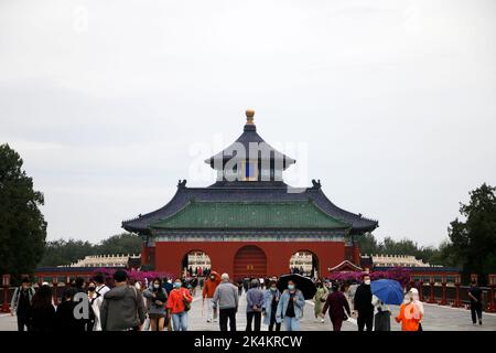 Tourists visit the Temple of Heaven Park and admire the magnificent ...