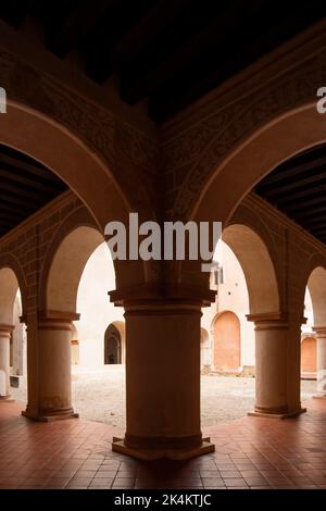 colonial architecture, arches surrounded by vegetation, play of light ...