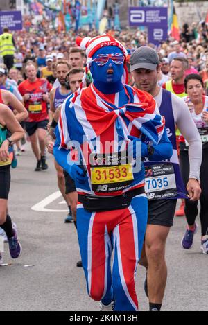 Calum Titley running in the TCS London Marathon 2022, on Tower Bridge ...