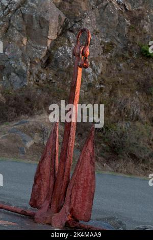 Classic 'Danforth' fluke-type rusty boat anchor, overlooking bay ...