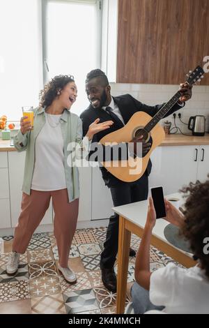 The businessman playing guitar at home Stock Photo - Alamy