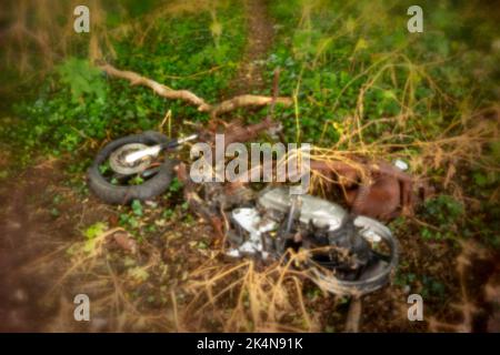 Environmental pollution and waste exemplified by motorcycle carelessly ...