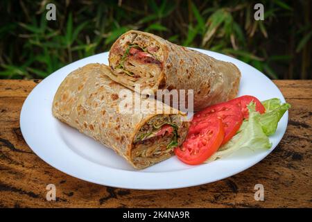 Ugandan Rolex, commonly referred to as Rolex, is a popular food item in ...