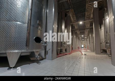 Modern wine cellar with new large inox stainless steel tanks for the ...
