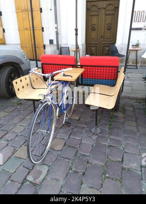 Krakow, Poland - August 4, 2018: ornamental bicycle with table and ...