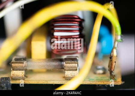 Brown damaged fuse that has blown and defective Stock Photo - Alamy