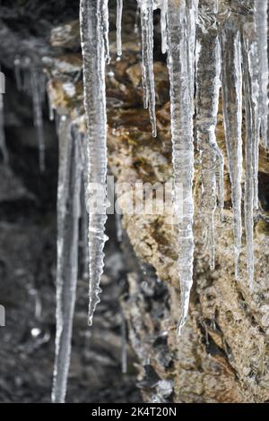 Icicles on a rocky mountain during winter season Stock Photo - Alamy