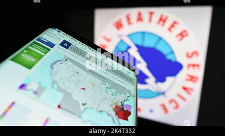 Mobile phone with website of US NWS division National Hurricane Center ...