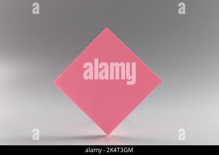 Pink blank paper rhombus on gray background, notepad Stock Photo - Alamy