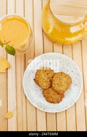 Aesthetic autumn breakfast with healthy sea buckthorn tea and vegan ...