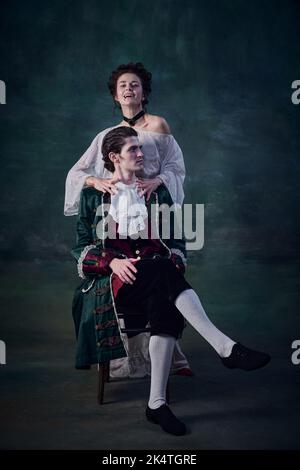 Vampire man strangling woman in dark room Stock Photo - Alamy