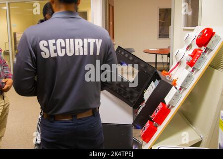 Fire alarm and mock sprinkler system attached to a white wall used for ...