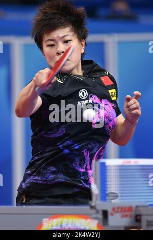 Malaysia’s Li Sian Alice Chang plays a shot against Wales’ Charlotte ...
