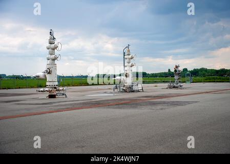 Three closed gas taps from a gas extraction location of the Groningen ...