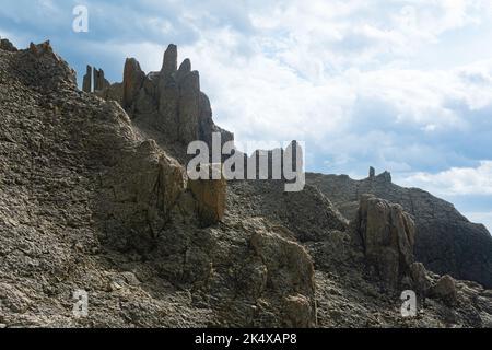 majestic rocks from volcanic columnar basalt against the sky, natural ...