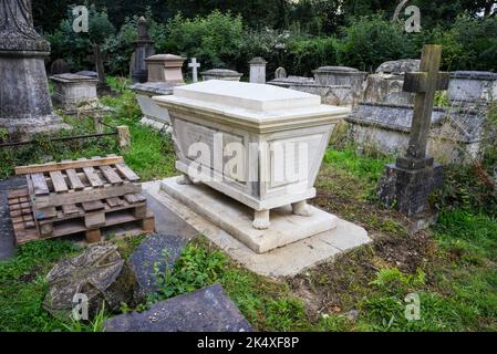 A 19th-century table tomb undergoing repair and restoration in ...