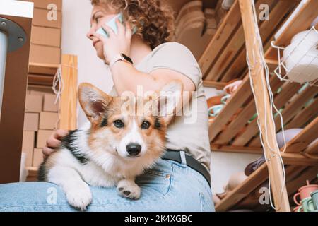 Smiling concentrated businesswoman talking smartphone, working on ...