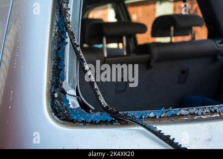 broken rear window of the car. the remains of car glass in the window ...
