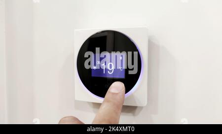 Wall mounted digital climate control and home thermostat Stock Photo ...