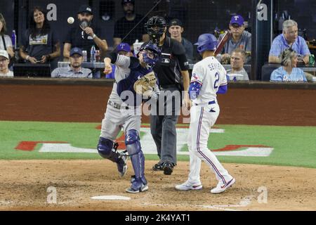 Texas Rangers' Kyle Higashioka, second from left, talks with first base ...
