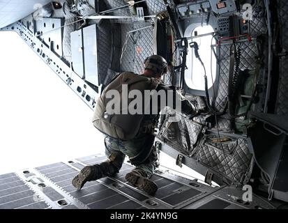 A Jumpmaster from the U.S. Army John F. Kennedy Special Warfare Center ...