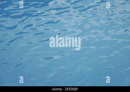 Blue swimming pool edge with refection of water ripple background Stock ...