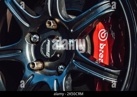 A vertical closeup of Blue Mitsubishi Evo VII logo detail Stock Photo ...