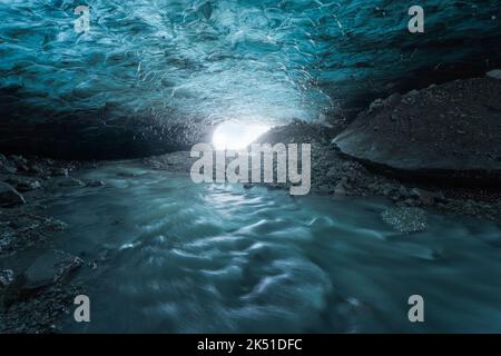 Interior of breathtaking ice cave with wet floor inside Vatnajokull ...