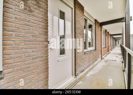 Long straight narrow passage of multistory residential apartment ...