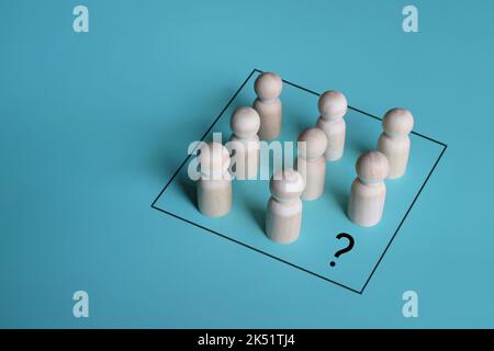 Wooden dolls and question marks. Job vacancy, human resources ...