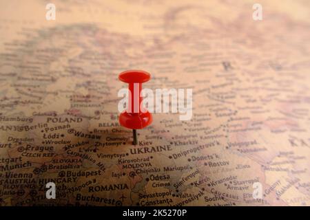 Bright sunlight illuminates territory Russia world map.Red button is ...