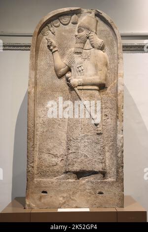 Assyrian wall relief of King Ashurnasirpal II and a winged genius or ...