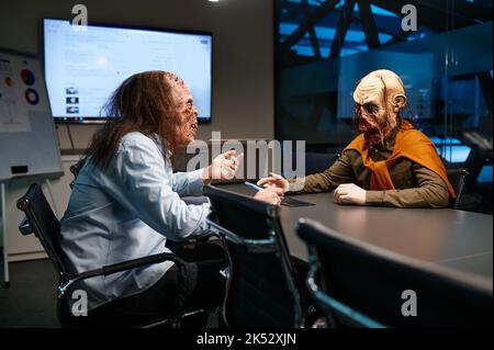 Zombie business meeting at corporate office. Two businessman monster ...