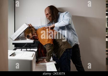 Office fun of zombie colleagues at work. Workers having fun. Employee ...