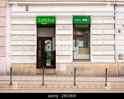 Żabka store front company logo symbol front view, shop facade up close ...