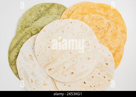Tomato, spinach flavored and plain wheat tortilla wraps. Spanish or ...