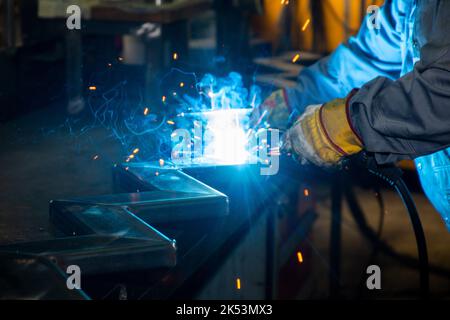 Locksmith doing welding work Stock Photo - Alamy
