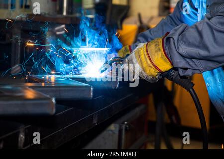 Locksmith doing welding work Stock Photo - Alamy