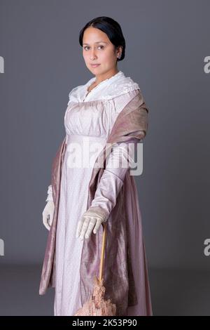 A Regency woman wearing a pink cotton gown Stock Photo - Alamy