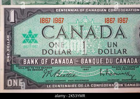 Canadian commemorative Centennial dollar bill on a diagonal selection ...