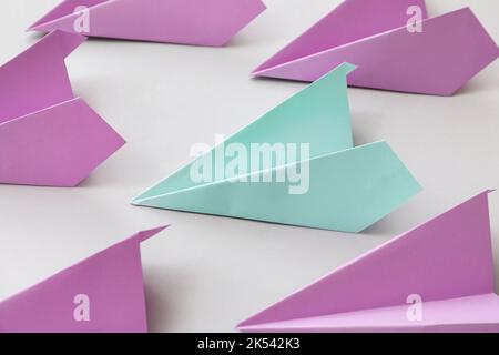 Colorful paper planes on grey background Stock Photo - Alamy