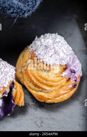 Home made ube cream puff with purple coloured white chocolate and ...