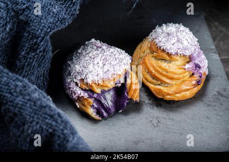 Home made ube cream puff with purple coloured white chocolate and ...