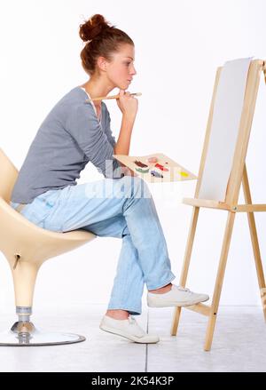 Thinking about what to do today. Studio shot of a casual young man ...