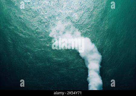 drone view of an underwater explosion and gas leak of the sea surface ...