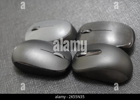 four different wireless mice on a white background Stock Photo - Alamy