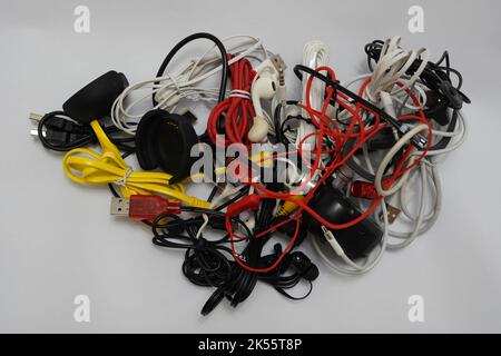 tangled cables of different types on a black background Stock Photo - Alamy