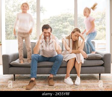 Stress parents, kids and jump on sofa in living room child problem for tired, sad and overworked ...